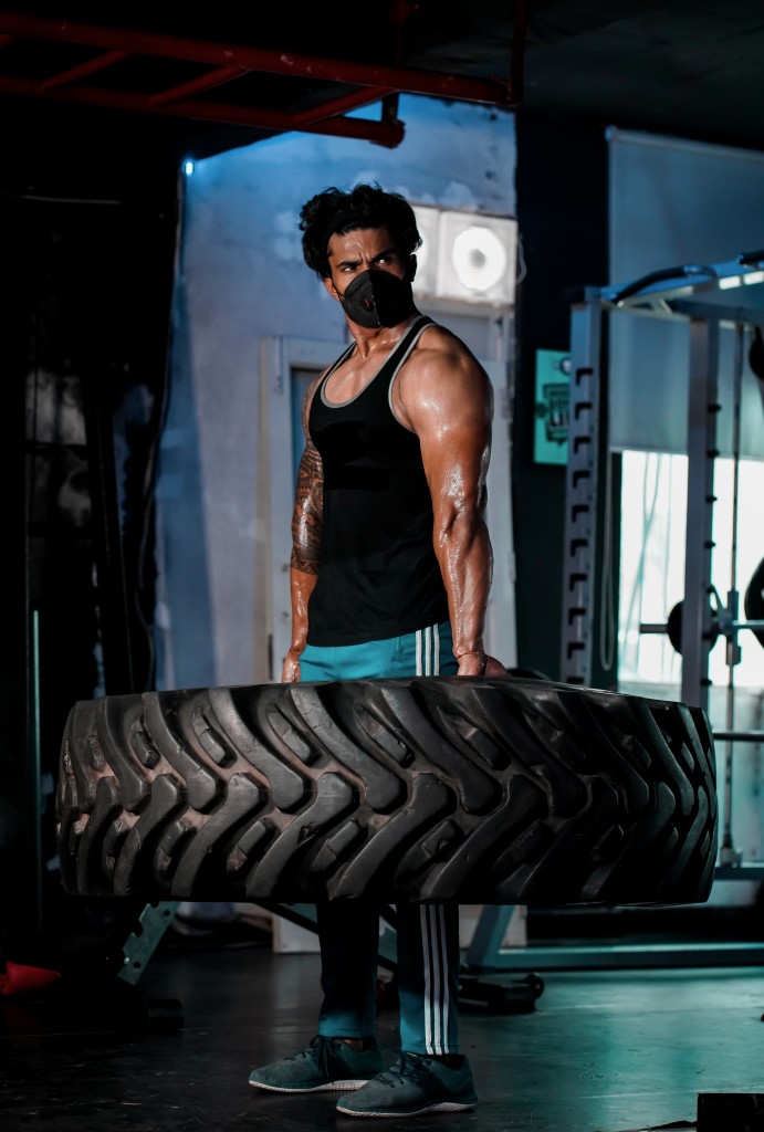 A gym goer lifting truck Tyre - PixaHive