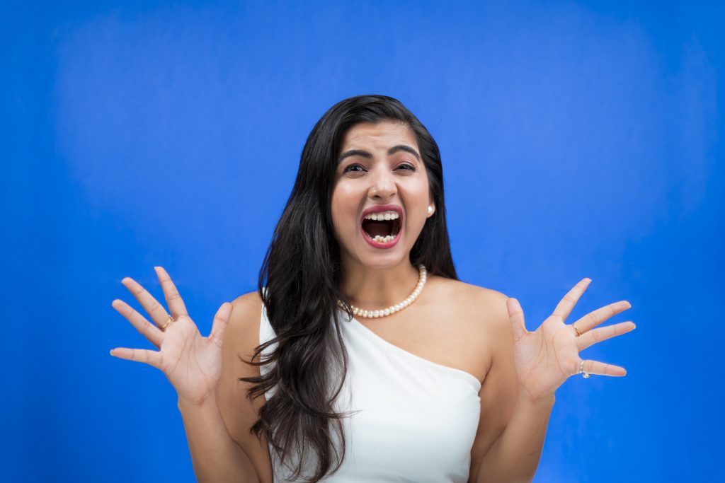 Angry woman screaming and showing her hands in both direction - PixaHive