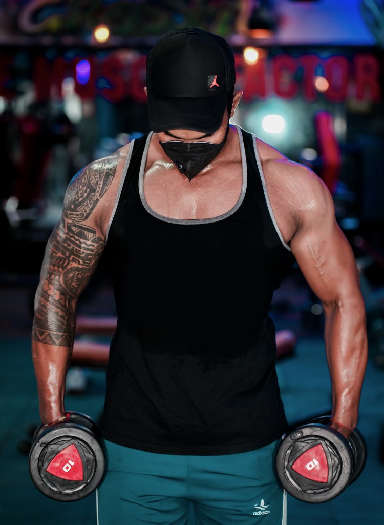 Bodybuilder Doing Exercises With Dumbbells - PixaHive