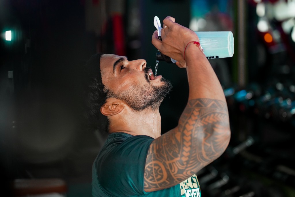 Bodybuilder drinking water - PixaHive