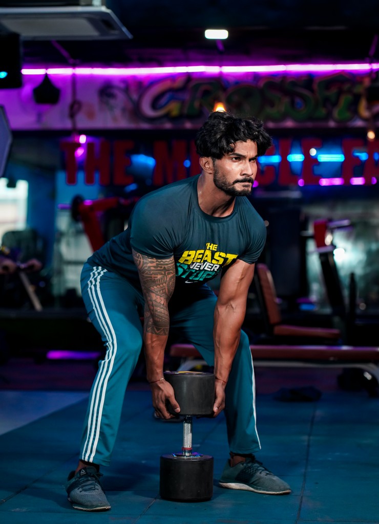 Bodybuilder workout with dumbbells - PixaHive