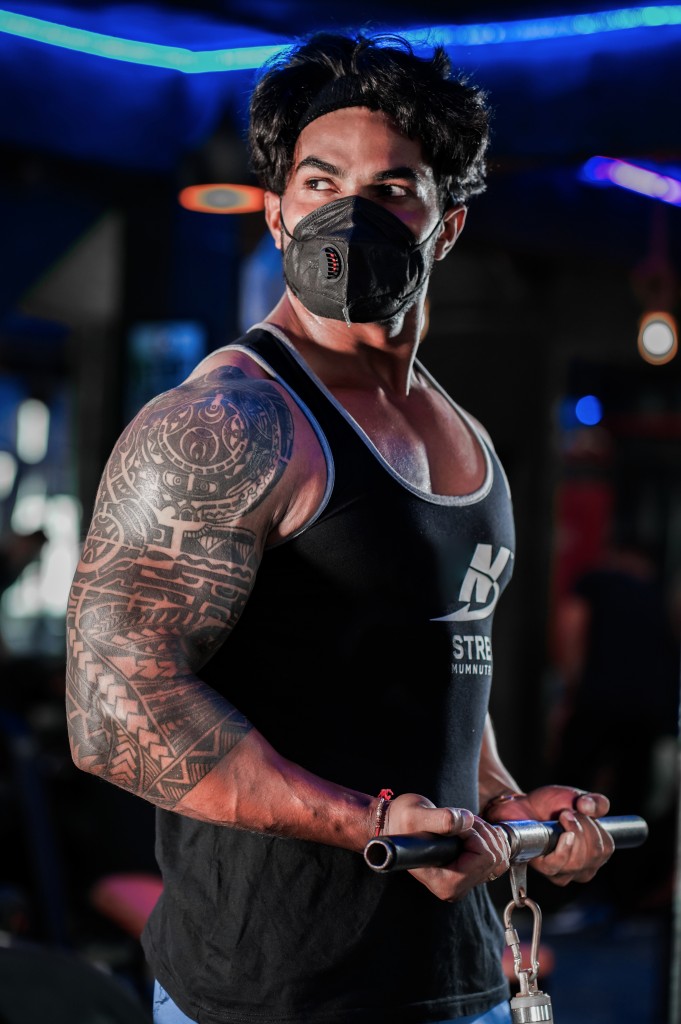 Fit Man Arm Exercise in the Gym - PixaHive