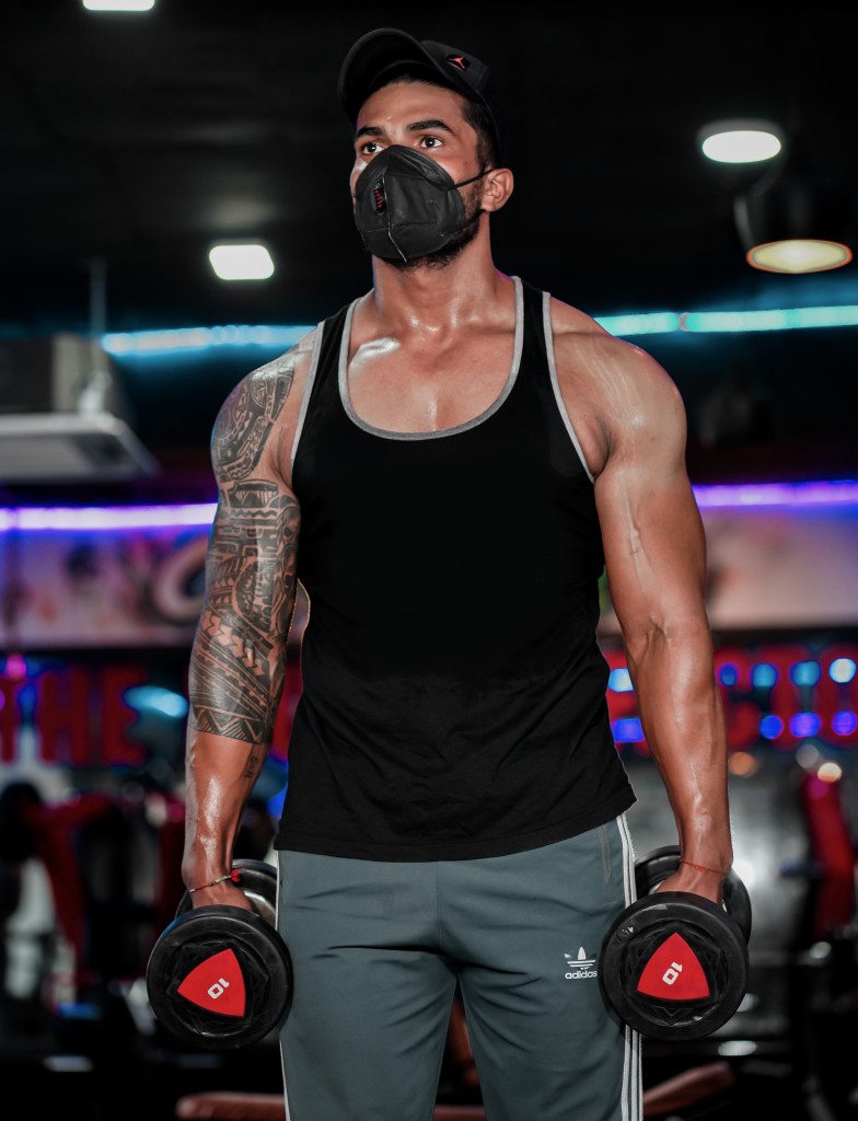 Fit Man on Dumbells in the Gym - PixaHive