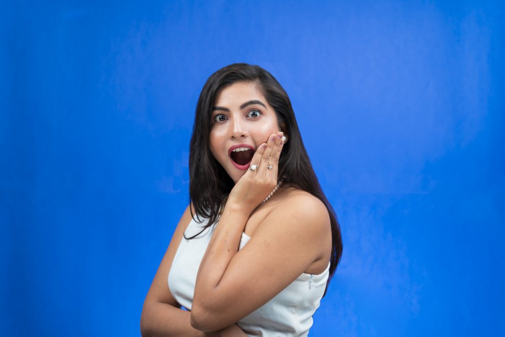 Girl putting her hand on her face - PixaHive