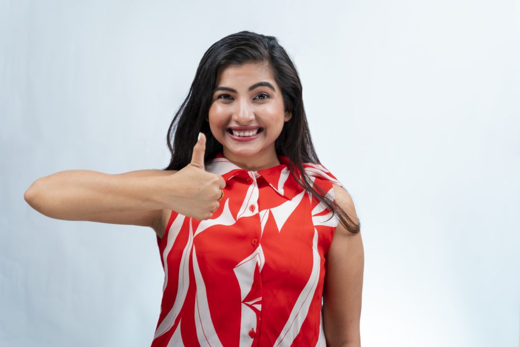 Indian girl doing thumbs up - PixaHive