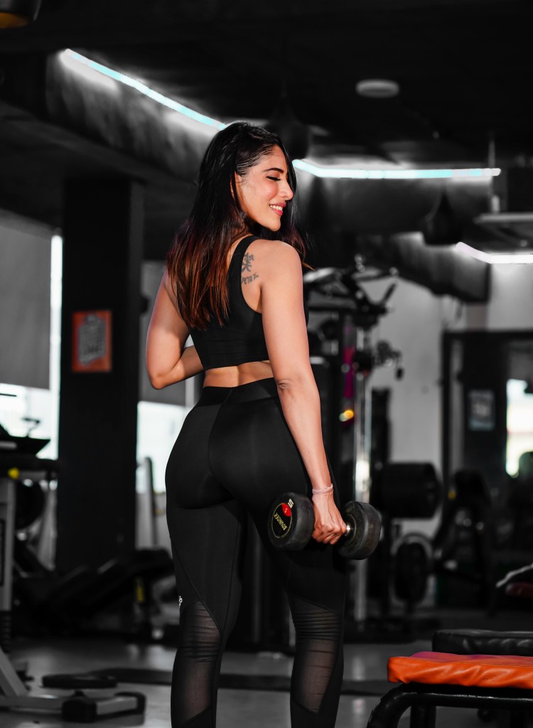 Slim and fit model with dumbbell - PixaHive