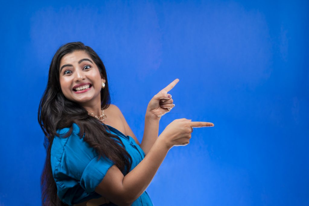 Woman pointing sideways - PixaHive