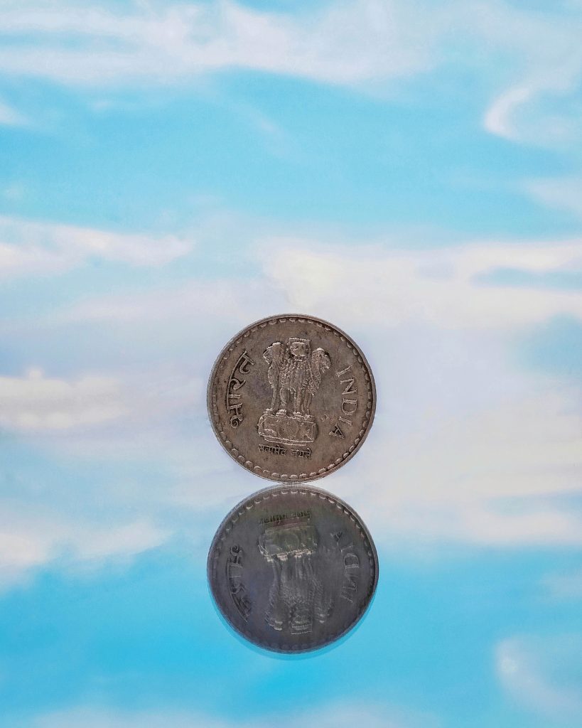 5 rupee coin with reflection and sky - PixaHive
