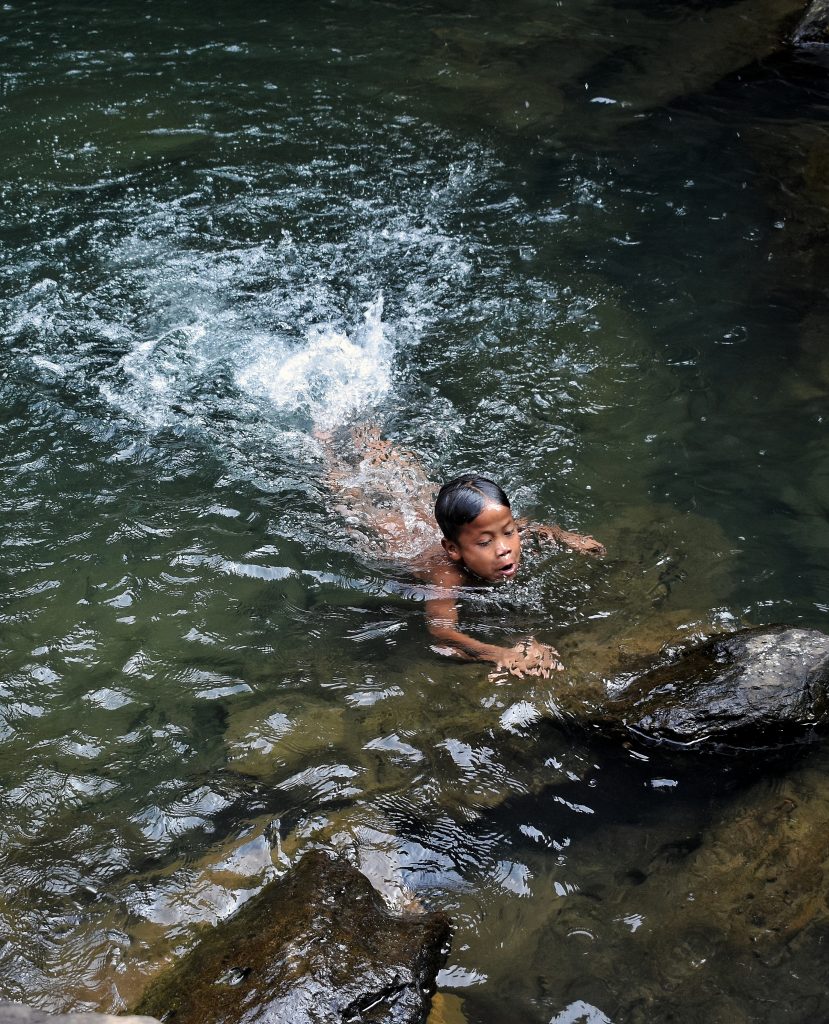 A Child Bathing in the Stream - PixaHive