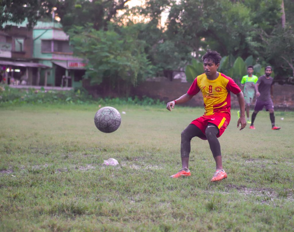 A football player and a ball - PixaHive