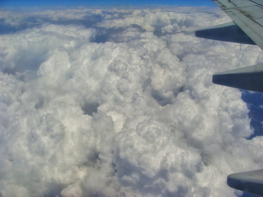 A plane flying above the clouds - PixaHive