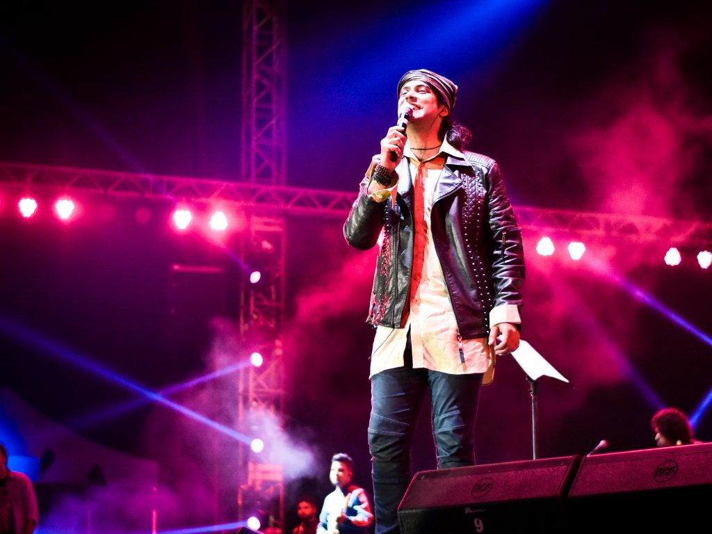 An artist performing on a stage - PixaHive