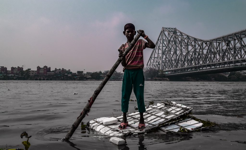 Boy rafting on a boat made by thermocol - PixaHive