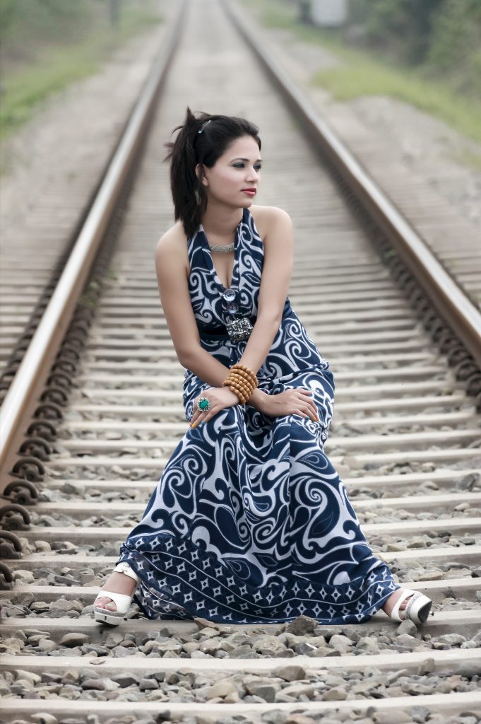 Girl sitting at railway track - PixaHive