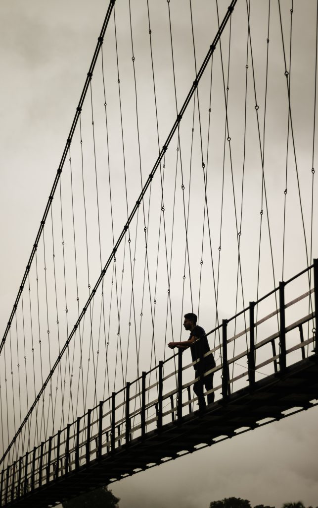 Man on the hanging Bridge - PixaHive