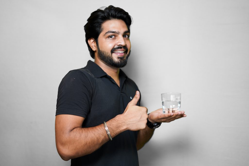 Man with a glass of water thumbs up - PixaHive