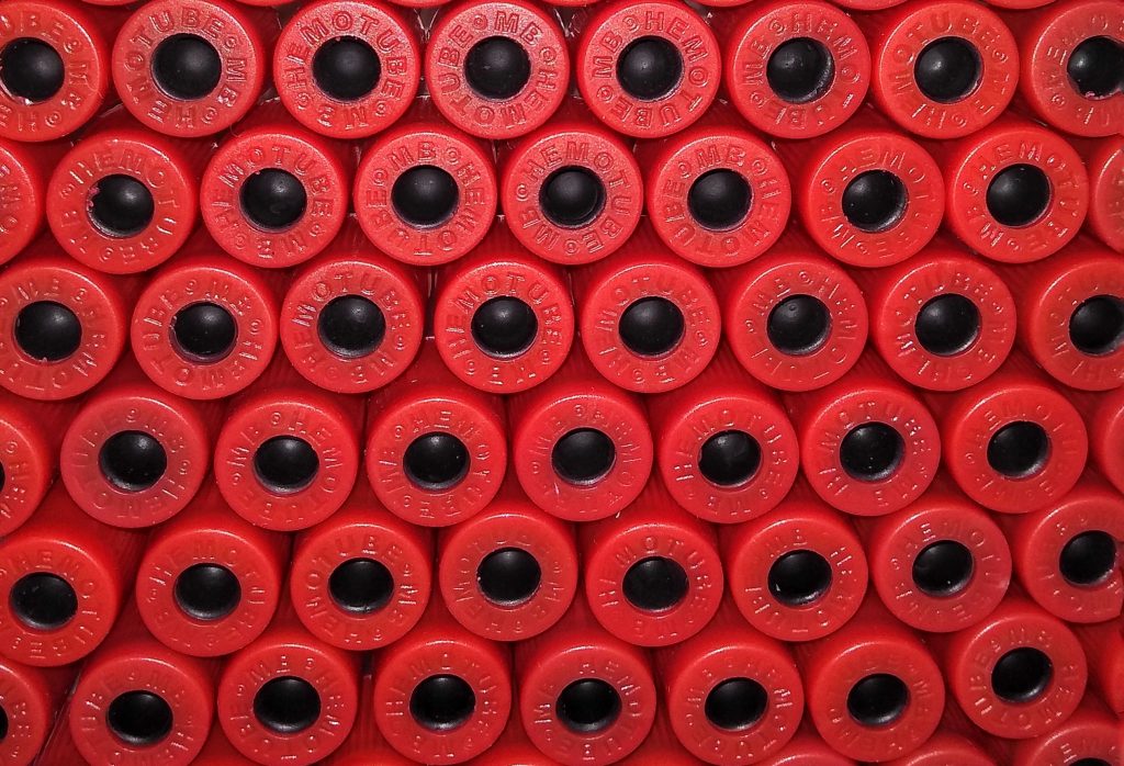 Red vacutainers in a pattern - PixaHive