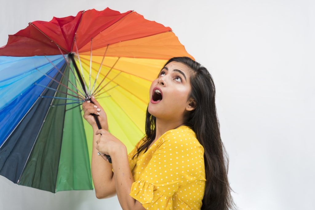 Shocked indian girl with colorful umbrella - PixaHive