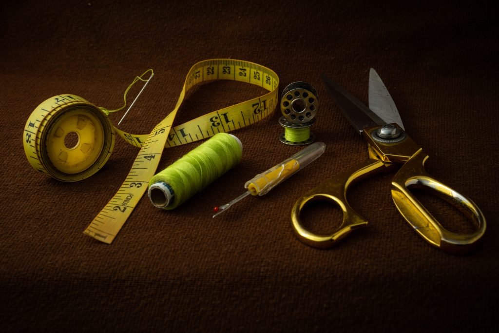 Tailoring materials kept on a brown matte background - PixaHive