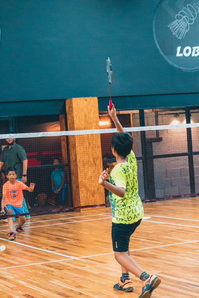 Two Kids playing a game of badminton - PixaHive