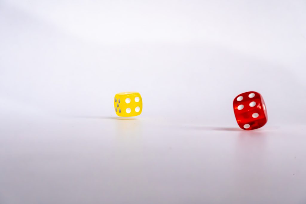 Two Rolling colored dice isolated on white - PixaHive