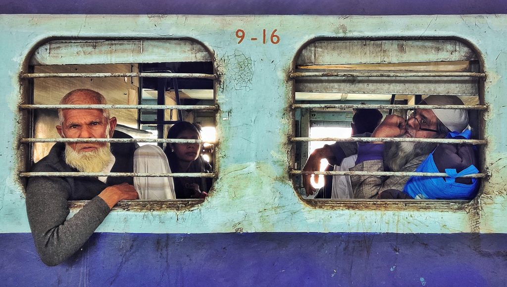 Man looking out of train window - PixaHive