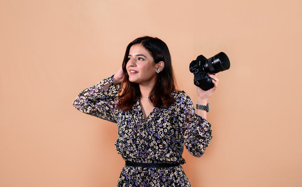 A Cute Girl holding Camera - PixaHive