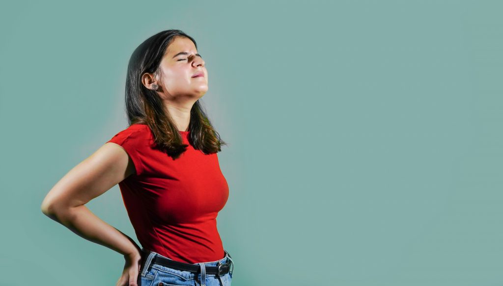 A girl in back pain - PixaHive