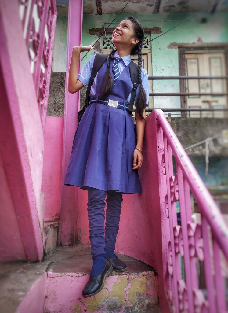 A girl student waving her hand. - PixaHive