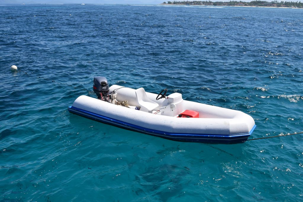 A motor boat floating in a sea - PixaHive