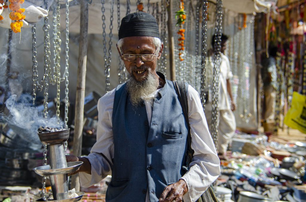 An old man in a market - PixaHive