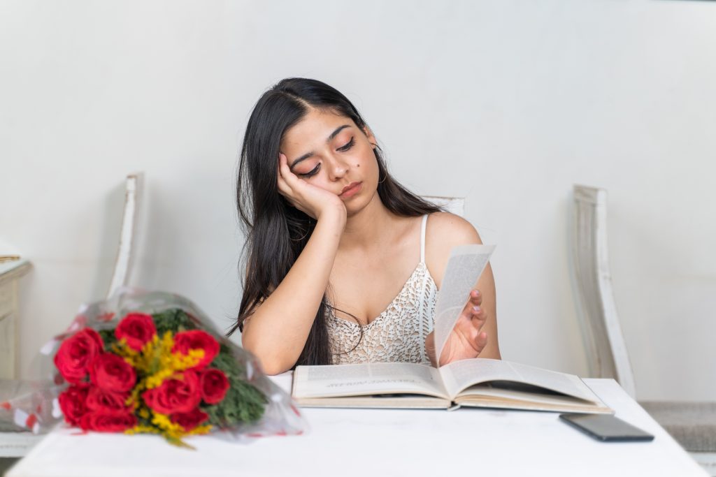 Beautiful girl waiting in cafe with flower - PixaHive