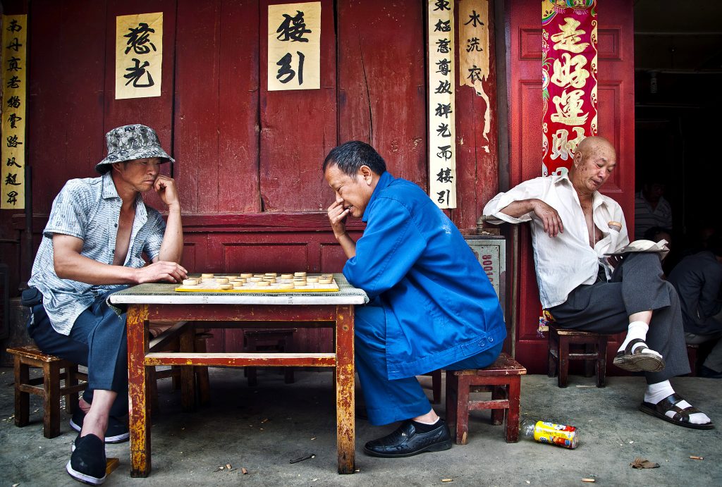 Men playing a board game - PixaHive