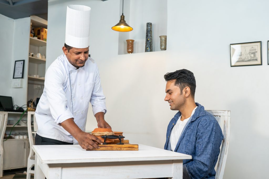 Chef putting food on table - PixaHive