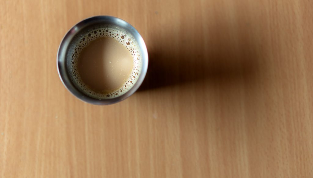 Coffee in a steel tumbler on a wooden table - PixaHive