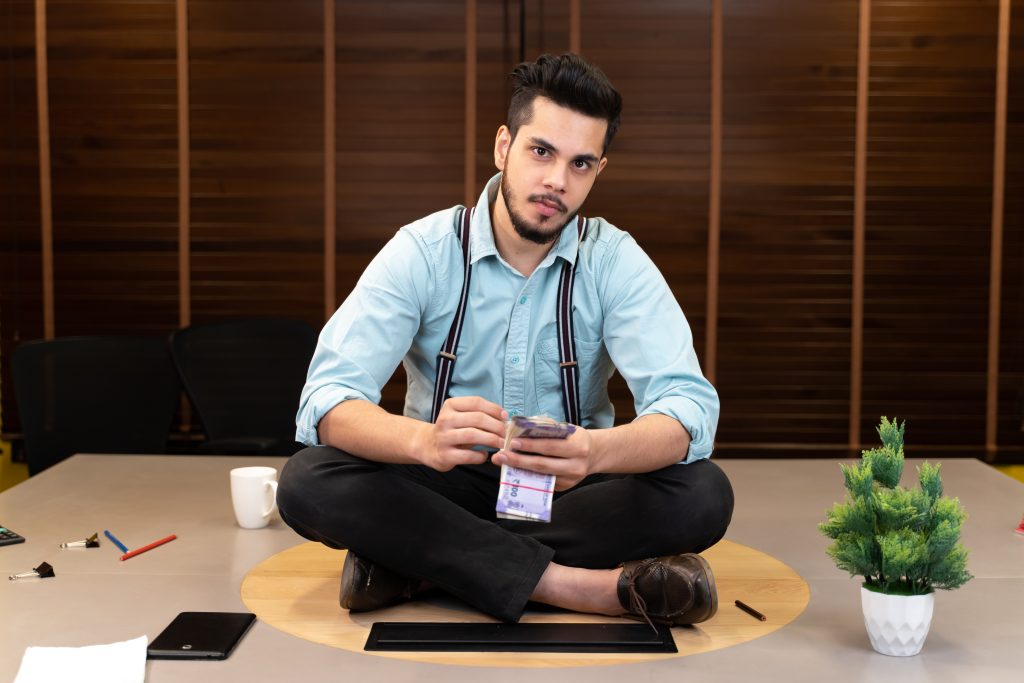 Confident businessman counting money - PixaHive