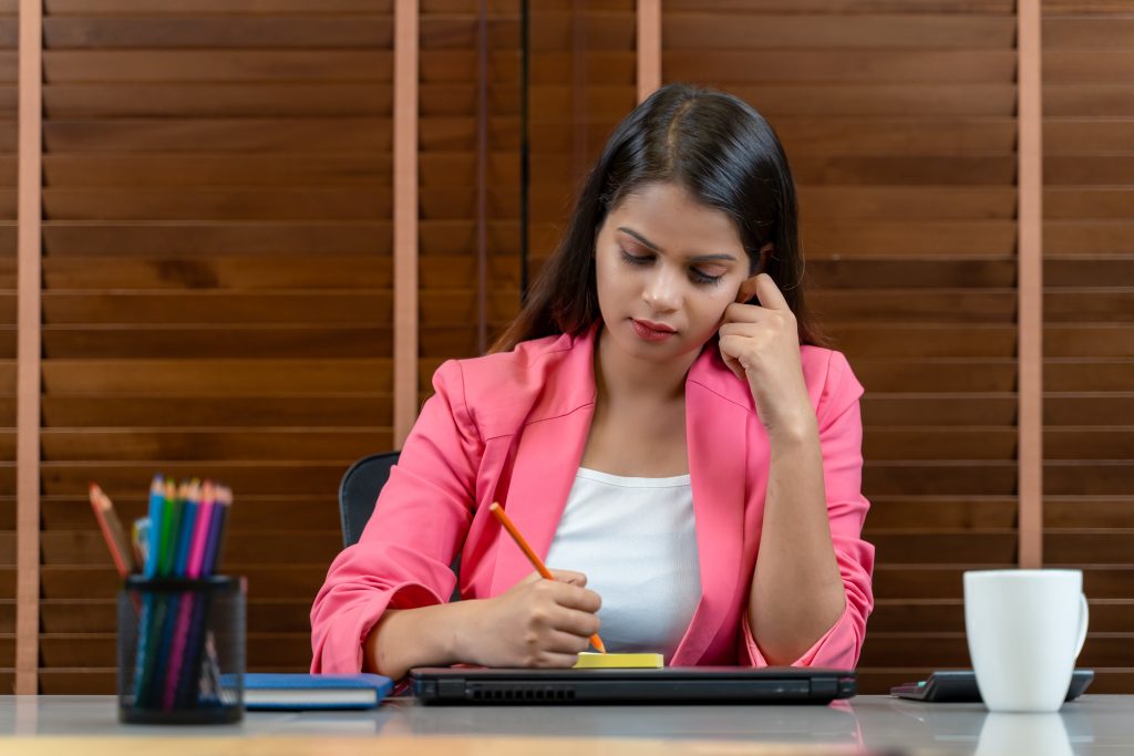 Employee taking notes during meeting - PixaHive