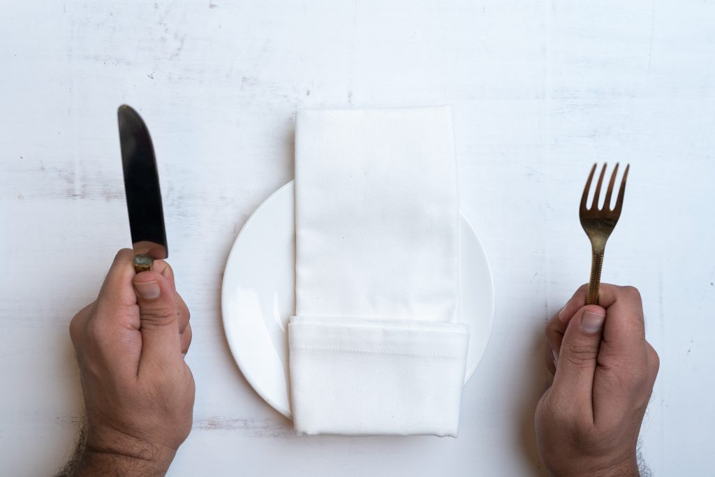 Hand holding knife and fork - PixaHive