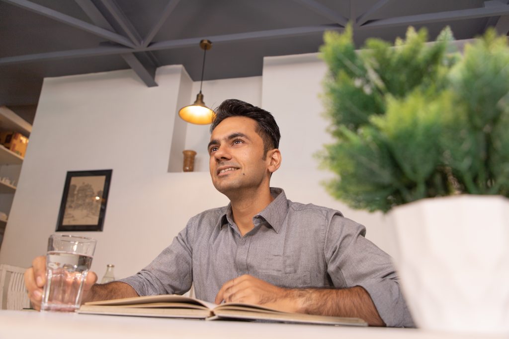 Happy looking man enjoying in cafe - PixaHive