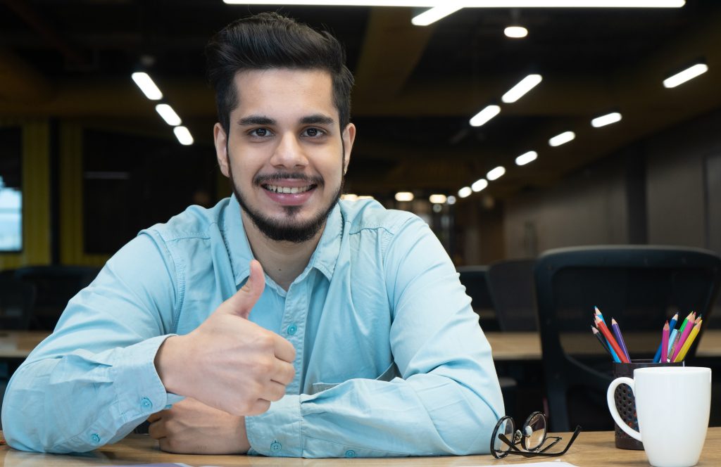 Happy manager showing thumbs up - PixaHive