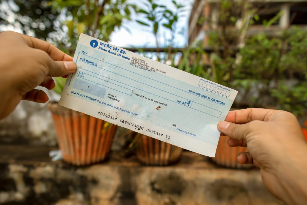 Holding a Bank Cheque - PixaHive