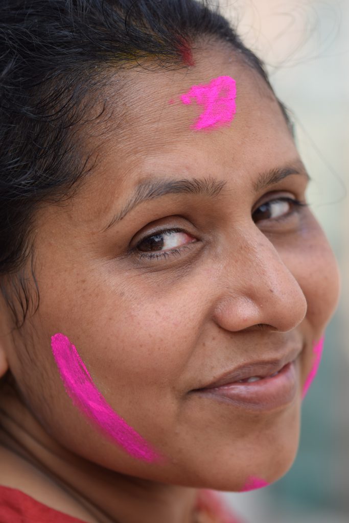 Holi color on woman face - PixaHive