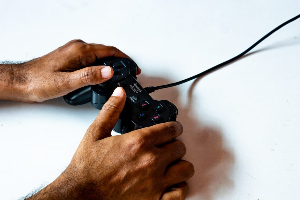 Human hands with a gaming console - PixaHive