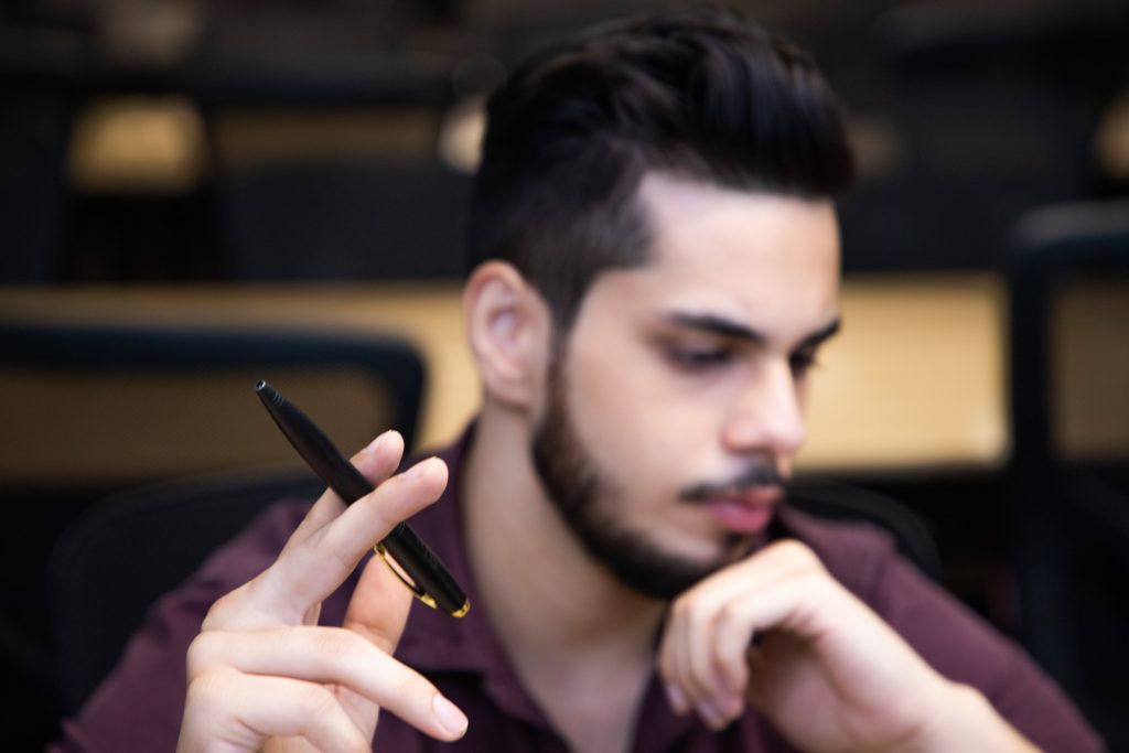 Man playing with pen - PixaHive