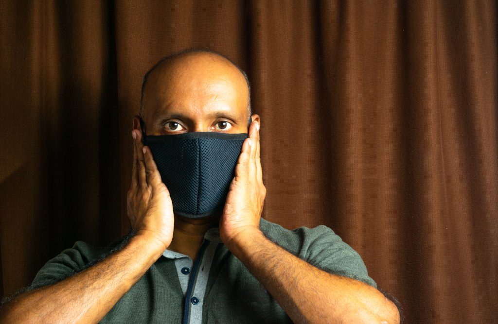 Man putting mask on his mouth - PixaHive
