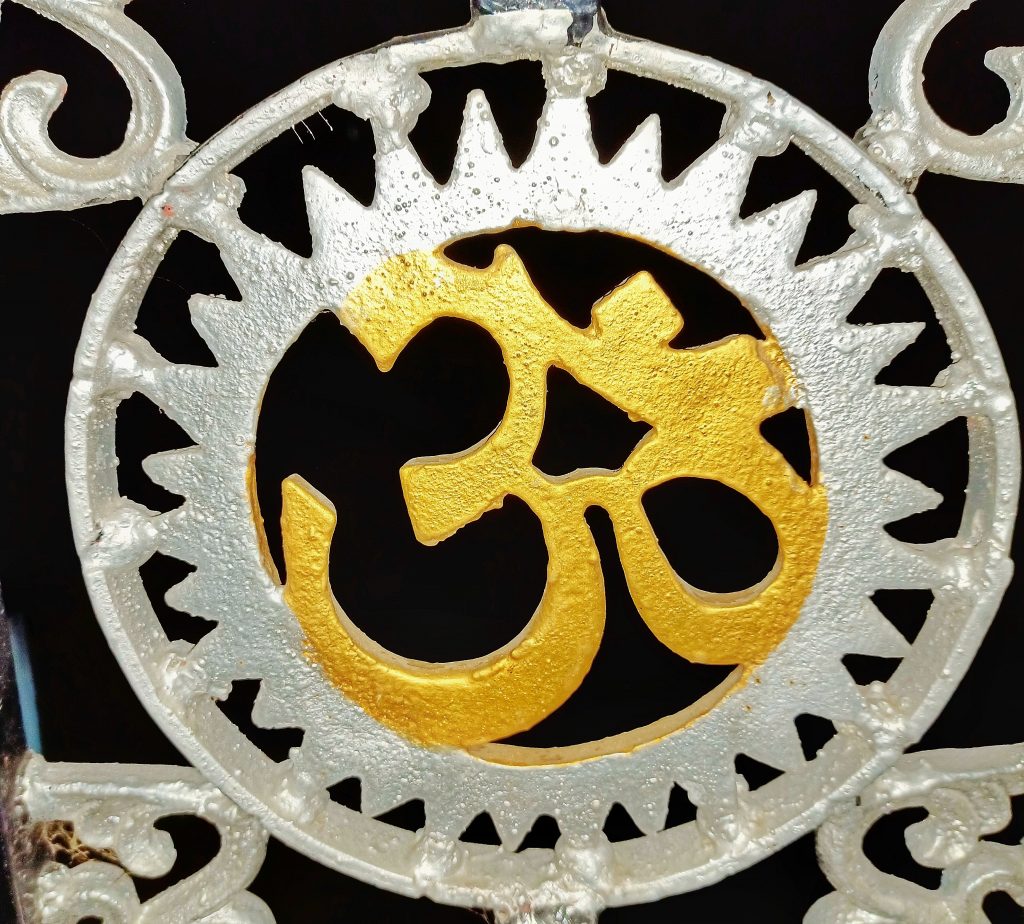 Om written on a metal structure - PixaHive