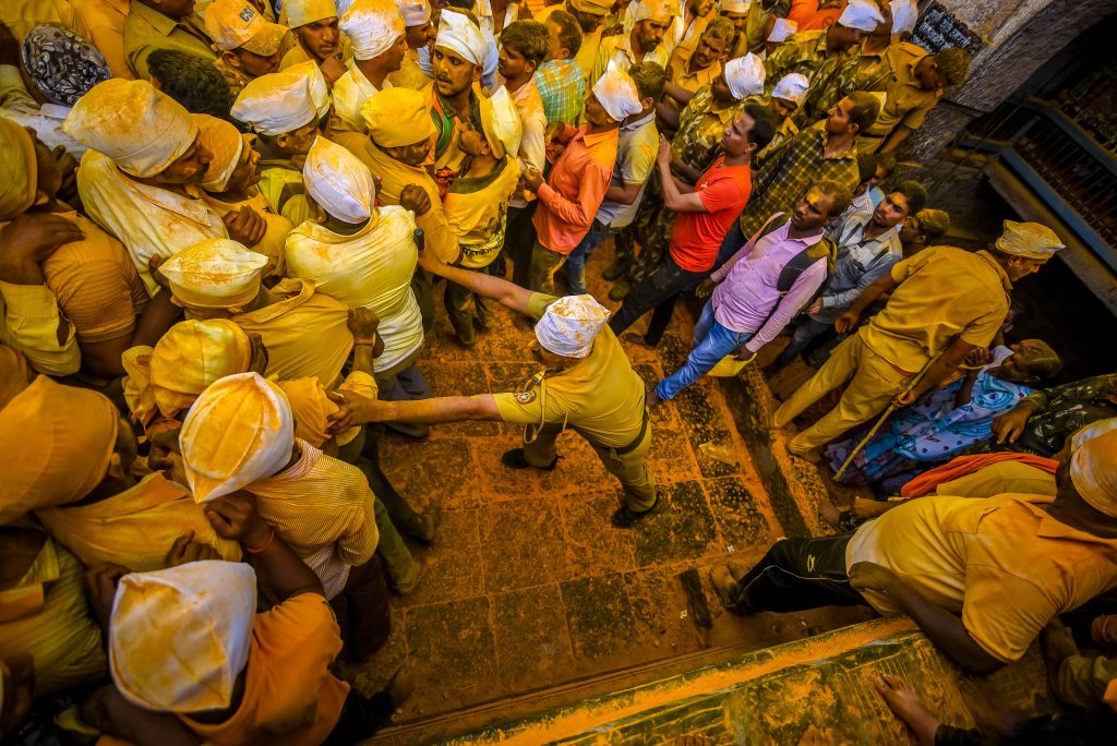 Home guards pushing crowd in a temple - PixaHive