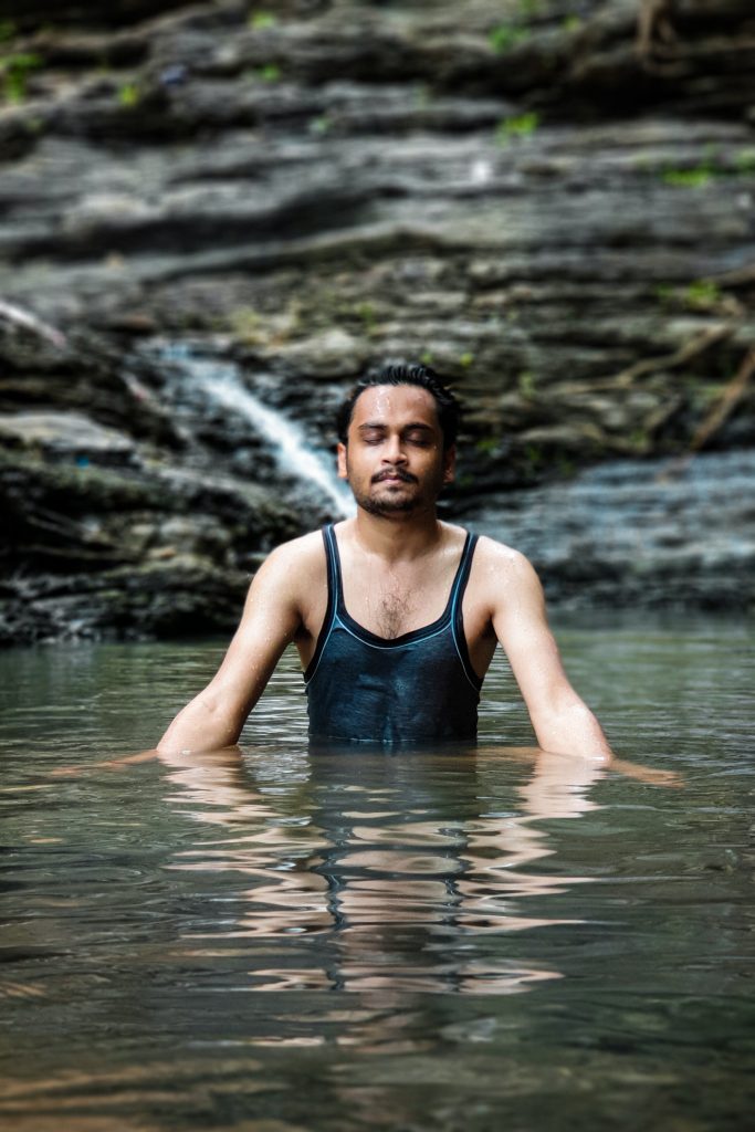 A boy meditating in a pond - PixaHive