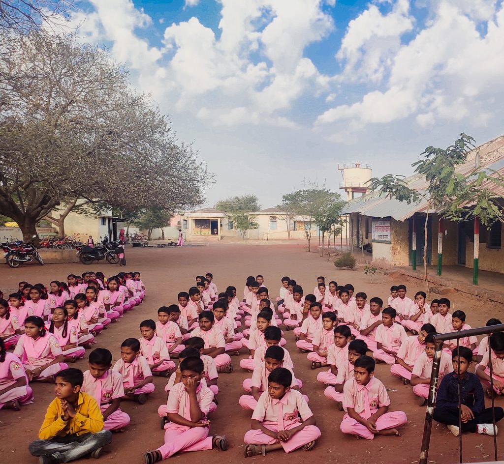 School students sitting in a row in their uniform. - PixaHive