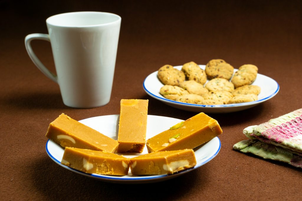 Sweet barfi in a white plate focused - PixaHive